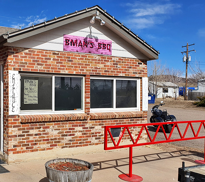 The unassuming brick exterior of B-Man's BBQ might fool you, but that pink sign is basically a smoke signal saying "life-changing brisket happens here."