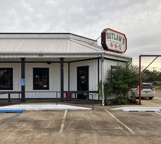 The unassuming exterior of Outlaw's BBQ hides a smoky paradise within. Sometimes the best treasures come in simple packages.