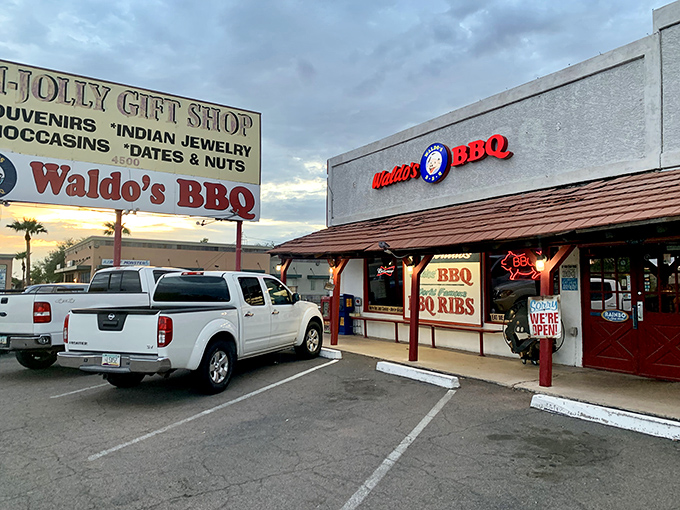 The unassuming exterior of Waldo's BBQ in Mesa might fool you, but that neon sign is basically a lighthouse guiding hungry souls to smoky salvation.