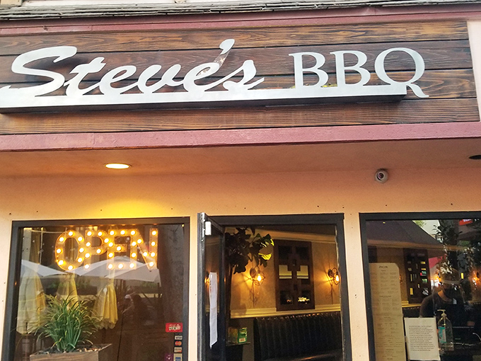 The wooden sign beckons like an old friend &ndash; Steve's BBQ in Whittier promises smoky treasures behind that glowing "OPEN" sign.