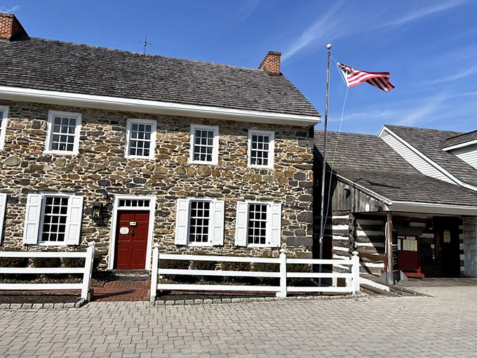 History stands proudly in stone and timber at Dobbin House, where the American flag waves as if to say, "Come in, the prime rib is waiting!"