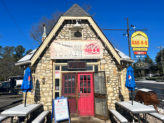 The stone fortress of flavor stands proudly on Old Monroe Road, its A-frame design practically whispering "come inside for barbecue magic" to passing cars.