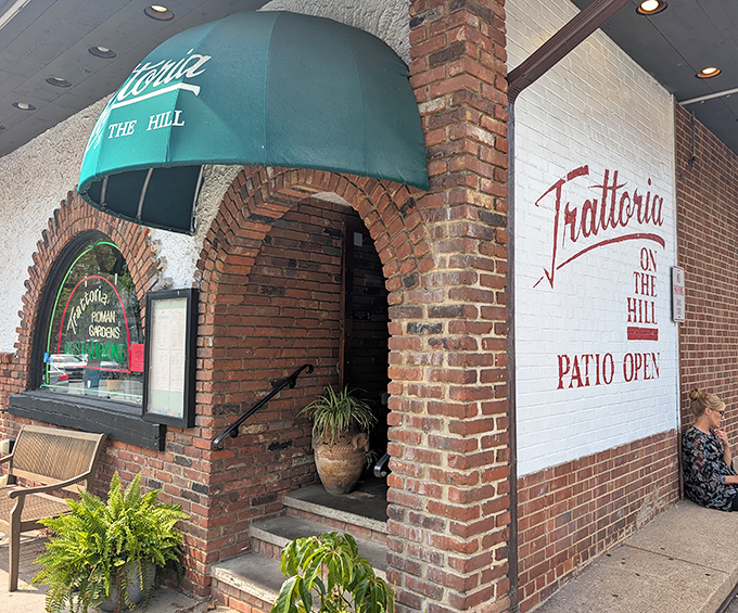 The iconic green awning and brick archway of Trattoria Roman Garden welcome you like an old friend inviting you in for dinner.