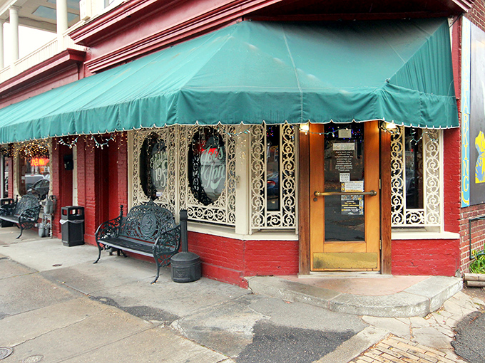 The iconic corner brick building with its distinctive burgundy trim and black awning has welcomed Richmond diners for generations, standing as a beacon of comfort in the Fan District.