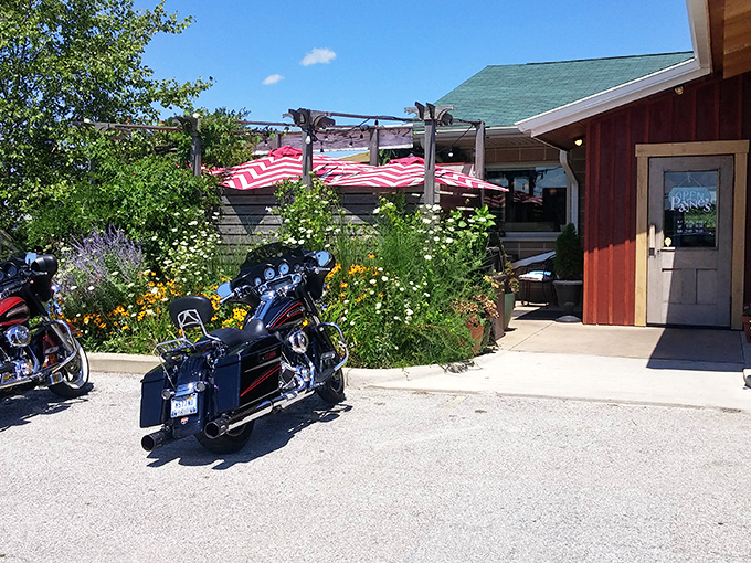 The garden entrance to Payne's welcomes motorcyclists and foodies alike with colorful flowers and a red-striped awning&mdash;Britain meets Midwest in perfect harmony.