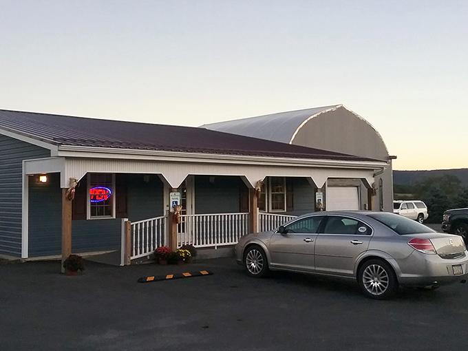 The glowing sign of Earlystown Diner promises "just like mom's home cooked meals" – a bold claim that, surprisingly, they actually deliver on.