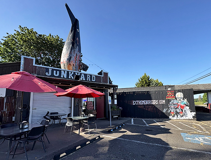 The airplane fin jutting from the roof isn't subtle advertising&mdash;it's a declaration that your taste buds are about to take flight at this corrugated metal wonderland. 