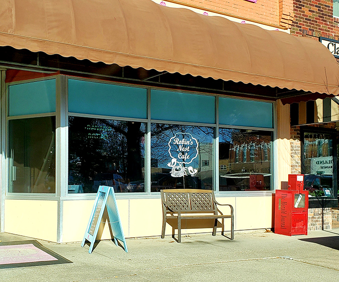 Bright pink window displays announce Robin's Nest Caf&eacute; like a cheerful billboard for breakfast bliss.