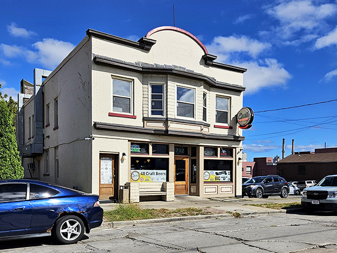 The unassuming white building with its vintage curved roofline stands proudly on a Milwaukee corner, like a humble superhero hiding burger powers within.
