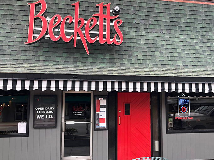 That striped awning and red door practically whisper "come on in, we've got something special waiting."