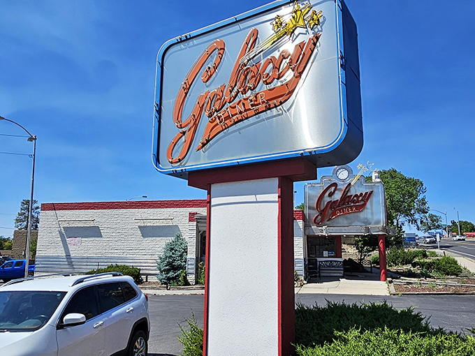 That neon sign isn't just announcing a restaurant&mdash;it's broadcasting a promise of time travel to an era when calories didn't count and chrome was king.