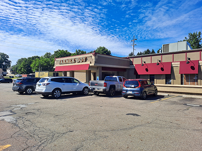 Morning sunshine bathes the Farmer Boy parking lot, where locals know that empty spaces fill quickly when word gets out about their hash browns.