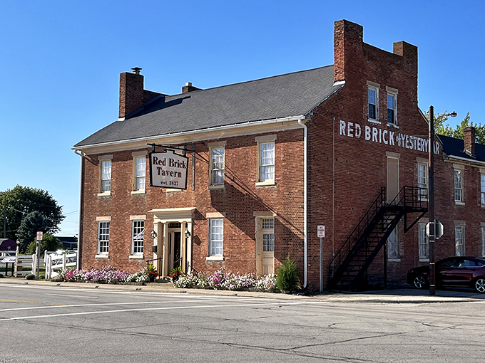 he Red Brick Tavern stands proudly since 1837, its vibrant flower boxes adding a splash of color to nearly two centuries of American history.