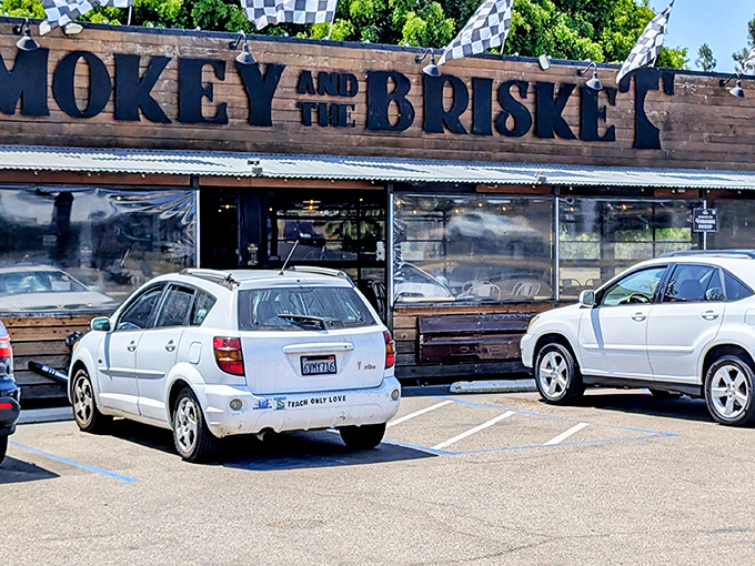 Rustic wood siding and checkered racing flags announce you've arrived at meat paradise – no fancy frills needed when the barbecue speaks for itself.