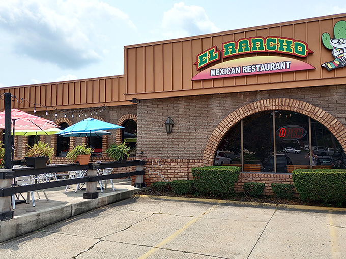 El Rancho's welcoming fa&ccedil;ade promises authentic flavors behind those brick arches. The colorful umbrellas practically whisper, "Siesta can wait&mdash;it's taco time!"