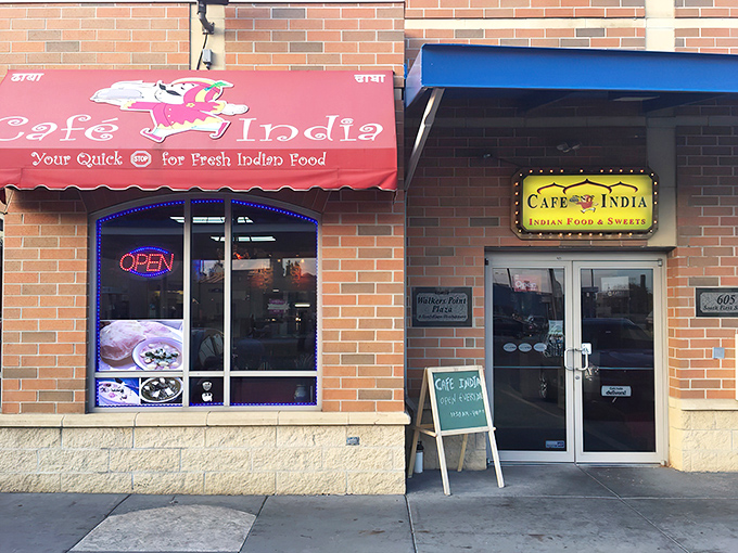 The bright red awning of Cafe India beckons like a culinary lighthouse in Milwaukee's urban landscape, promising authentic flavors that transport you halfway around the world.