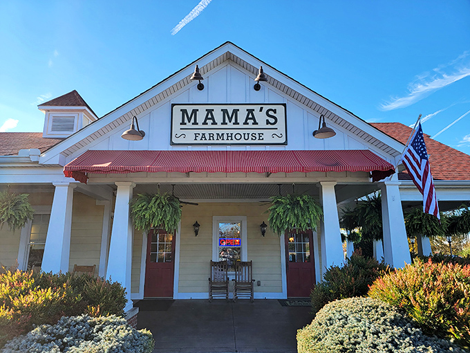 The classic white farmhouse exterior of Mama's Farmhouse welcomes you like an old friend, complete with rocking chairs that practically beg you to sit a spell.