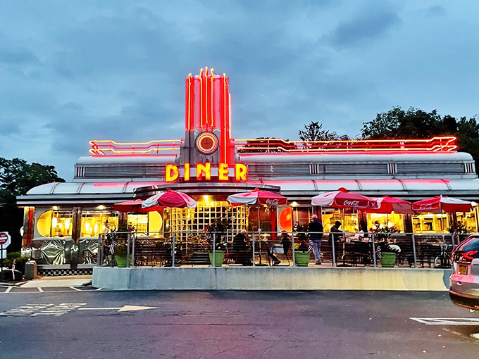 That neon glow isn't just a sign &ndash; it's a beacon calling hungry souls home to happiness.