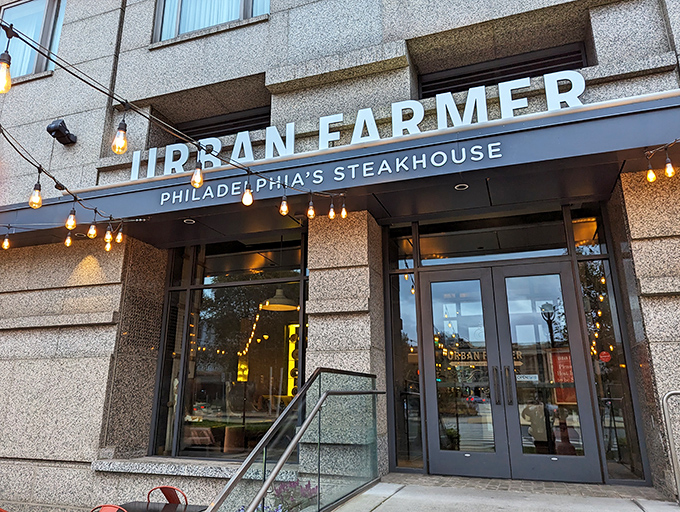The sleek exterior of Urban Farmer beckons with warm string lights and modern signage&mdash;like a sophisticated barn that went to design school.