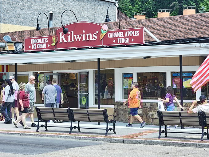 The red storefront of Kilwins beckons like a sweet siren call amid Gatlinburg's bustling strip. Mountain air and sugar &ndash; a perfect Tennessee pairing.