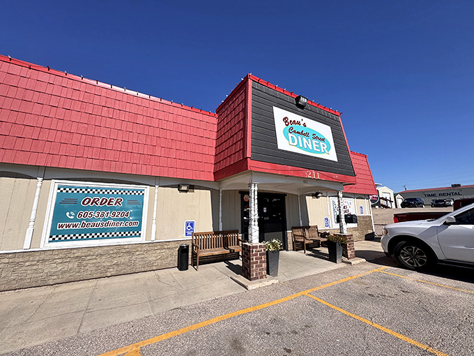 The bright red roof of Beau's Diner stands out against the South Dakota sky like a beacon for hungry travelers.