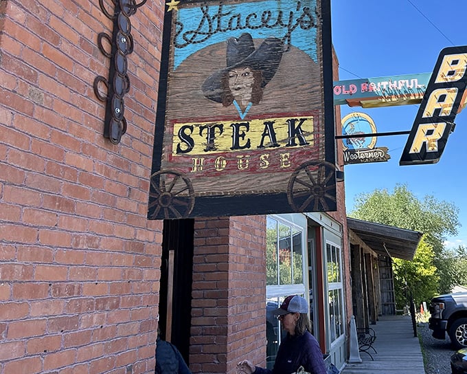 Howdy, partner! This sign's not just pointing the way to steak heaven &ndash; it's practically lassoing you in with Western flair.