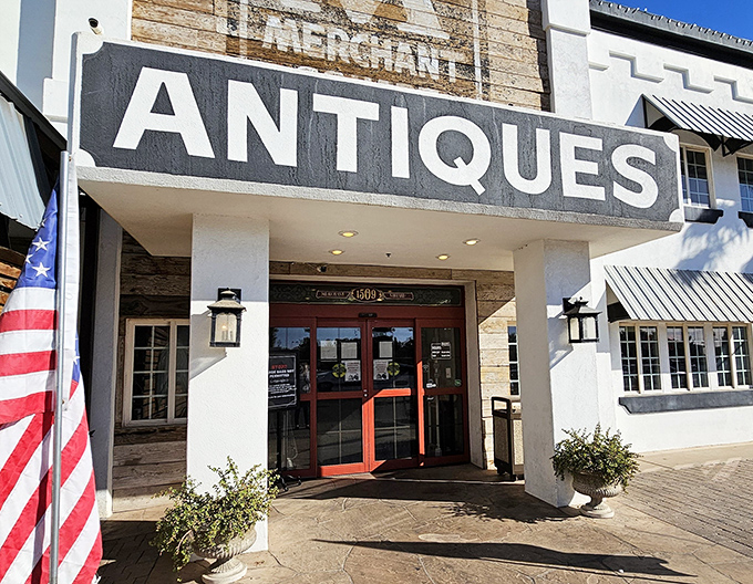 Another view of Merchant Square's welcoming entrance, complete with American flag&mdash;a portal to the past that promises adventures in every aisle.