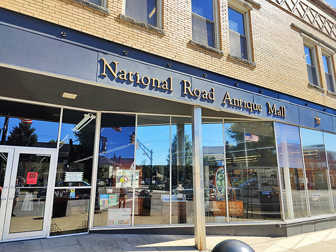 That classic navy blue awning and gold lettering practically whispers, "Come inside, we've got stories to tell."