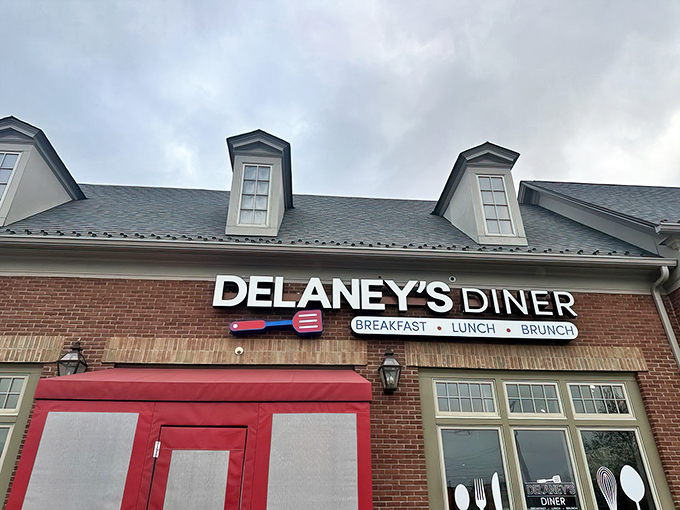 Delaney's charming brick exterior with its distinctive red entrance booth looks like it belongs in a Norman Rockwell painting of American dining perfection.