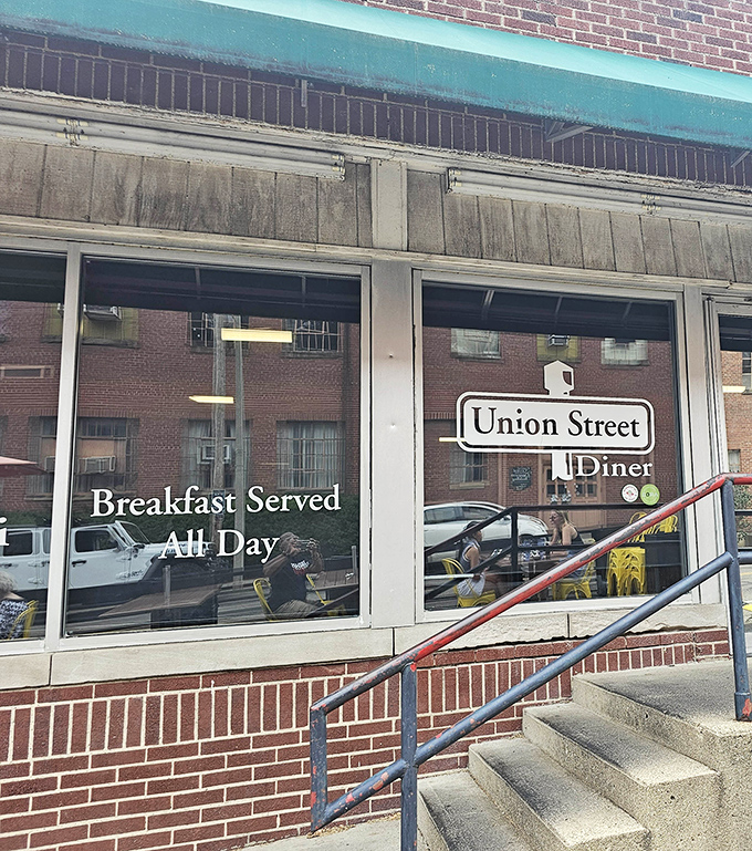 That turquoise awning beckons like a siren song, promising burger salvation just beyond those welcoming glass doors.