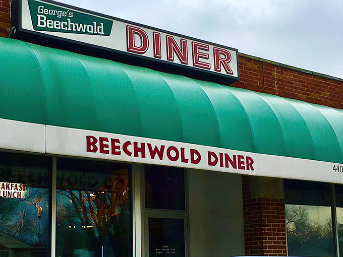 The iconic green awning of George's Beechwold Diner stands as a beacon of breakfast hope on Columbus's north side. No fancy frills needed when the food speaks this loudly.