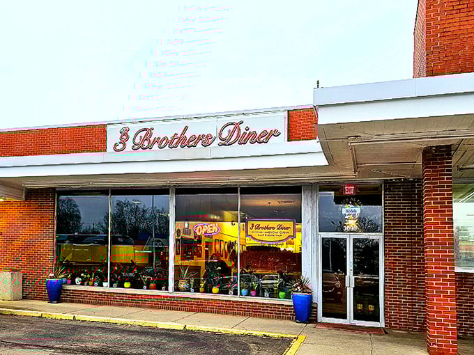 The unassuming brick exterior of 3 Brothers Diner proves once again that culinary treasures often hide in plain sight. Those blue planters are your first clue to the warmth waiting inside.