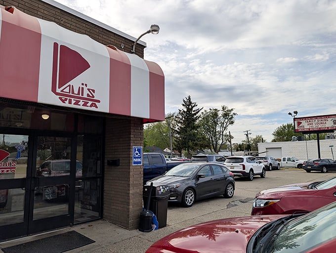 The red and white awning of Loui's Pizza beckons like a lighthouse for the pizza-obsessed. No fancy facade needed when what's inside is this good.