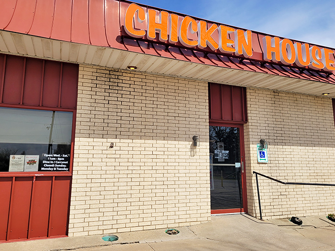 The iconic orange sign beckons like a lighthouse for fried chicken pilgrims. No fancy frills needed when what's inside has achieved culinary legend status.