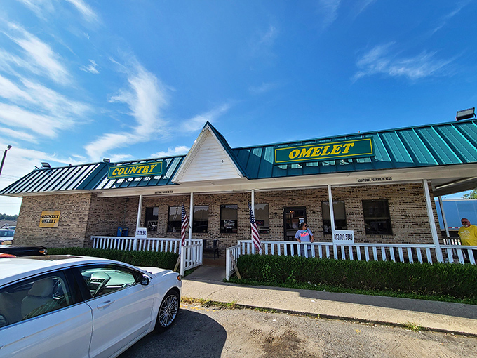 The yellow sign against brick says it all &ndash; Country Omelet isn't trying to be fancy, just serving up breakfast magic in Richburg's coziest corner. 