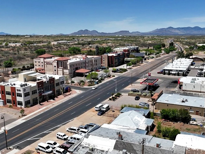 Main Street stretches toward the Huachuca Mountains, a perfect postcard of small-town Arizona where the desert meets civilization.