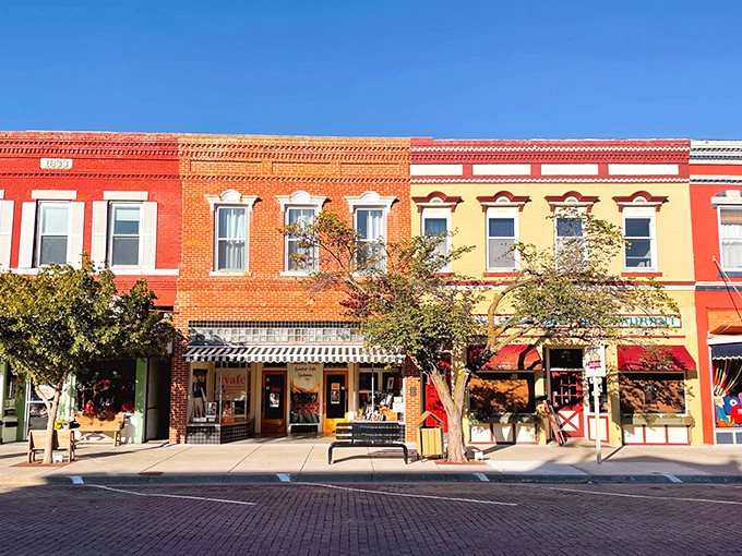Lindsborg's vibrant Main Street storefronts glow in the Kansas sunshine, their European-inspired facades inviting visitors to explore Little Sweden's treasures.
