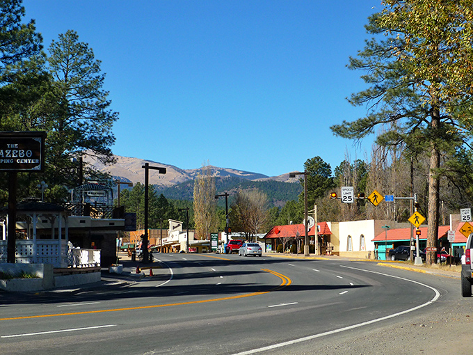 Main Street magic! Ruidoso's mountain backdrop transforms an ordinary drive into a scene worthy of a Bob Ross painting come to life.