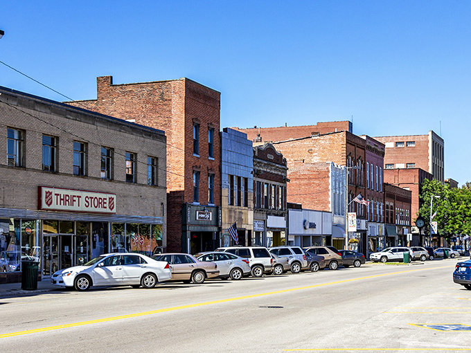 Historic brick buildings line Ashtabula's Main Street, where small-town charm meets big-time affordability. The thrift store promises treasures that won't dent your Social Security check.