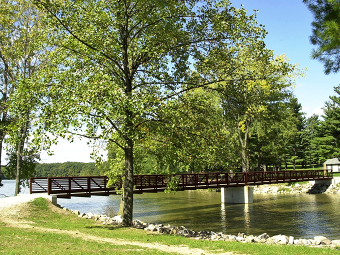 The wooden bridge at Harrison Lake State Park invites you to cross into a world where time slows and worries fade.