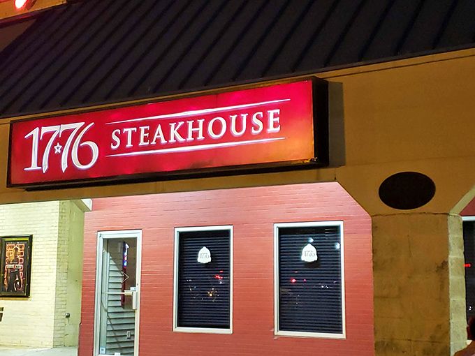 The iconic red sign glows like a beacon for beef lovers. 1776 Steakhouse stands proud in Rehoboth Beach, a revolutionary dining experience waiting to happen.