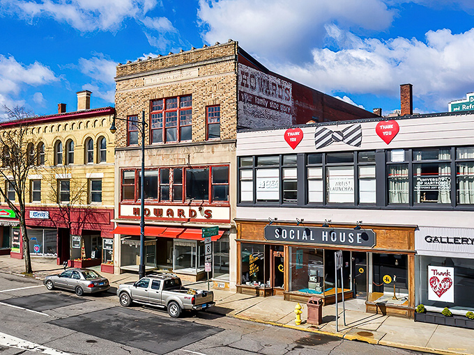 Main Street's vintage storefronts whisper stories of brass manufacturing glory days while embracing their second act.