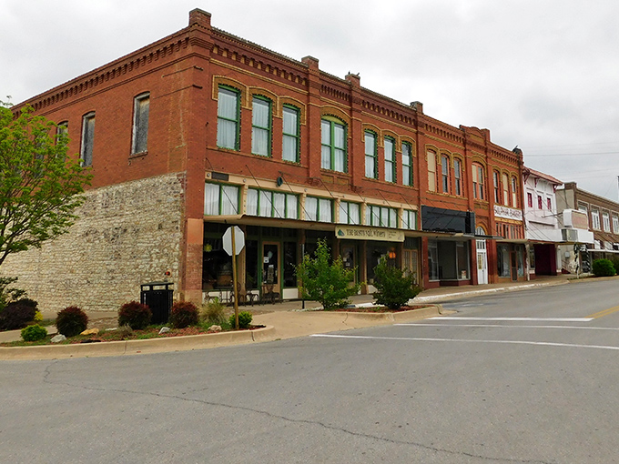 These historic brick buildings aren't just surviving—they're thriving, housing local businesses where transactions still include conversation.