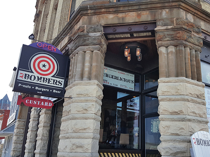 The historic stone facade of AJ Bombers stands proudly on Milwaukee's Water Street, its bullseye sign promising a direct hit to your hunger pangs. 