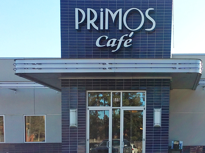 The sleek blue-tiled entrance of Primos Cafe promises Southern hospitality with a contemporary twist.