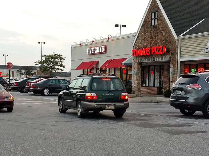Tonino's unassuming storefront sits beside a Five Guys, proving that sometimes the best pizza treasures hide in plain sight at suburban strip malls.