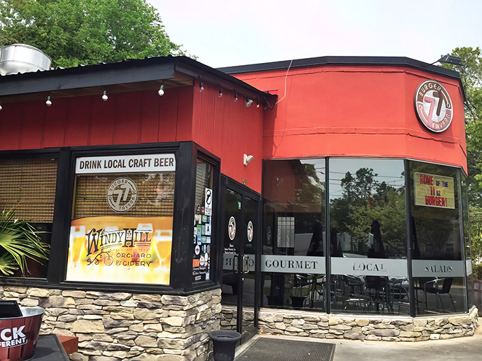 The vibrant red exterior of Burger Tavern 77 stands out like a beacon for burger enthusiasts, promising craft beer and gourmet delights inside.