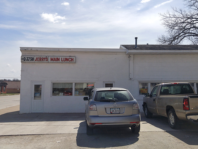 The unassuming white brick exterior of Jerry's Main Lunch stands as Burlington's time capsule of authentic diner culture. No frills, just thrills inside.