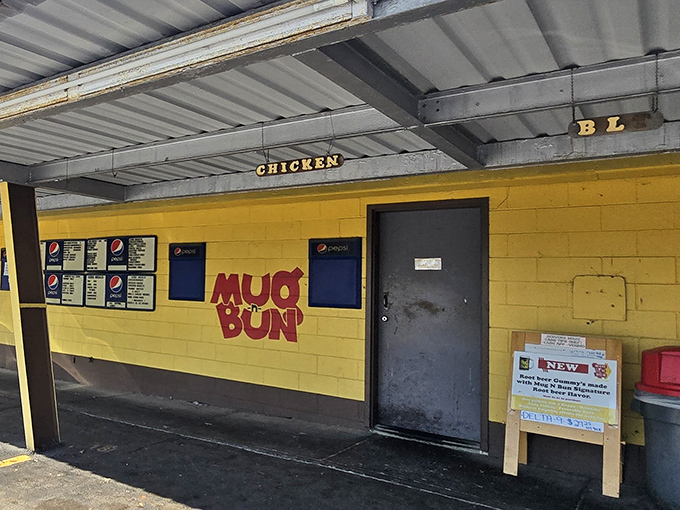 That yellow wall isn't just paint &ndash; it's a beacon calling hungry souls to drive-in paradise.
