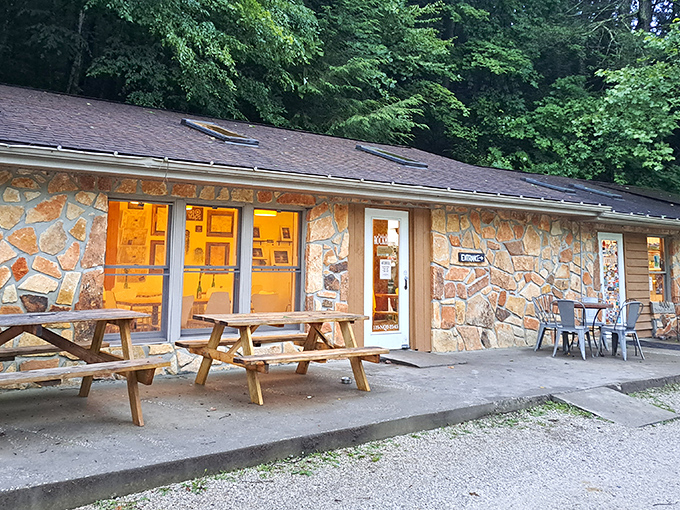 Stone walls that whisper "come in" and picnic tables that say "stay awhile" – this unassuming exterior hides culinary treasures within.